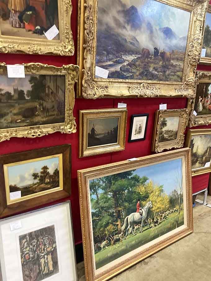 Ornate gilded frames showcase pastoral scenes that belong in a country estate, not a suburban living room.