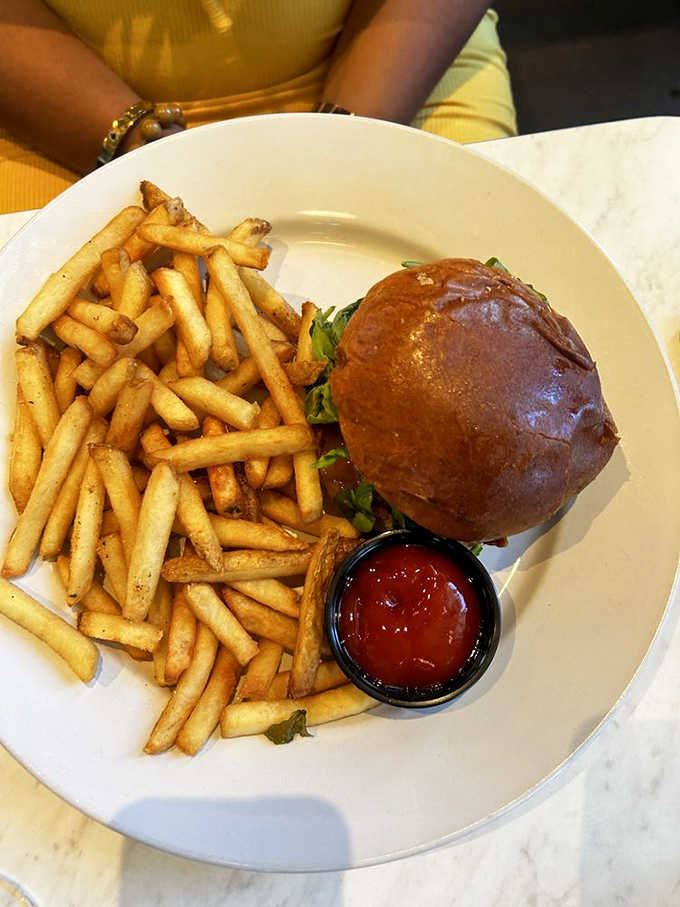 A breakfast burger with fries because sometimes you need lunch energy to tackle your morning, and that's perfectly acceptable.