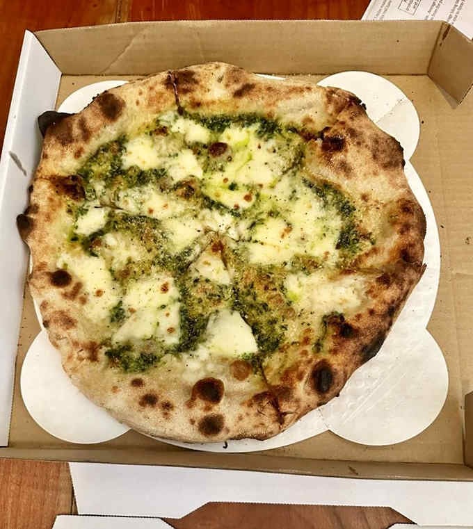 Pesto as a pizza base instead of tomato sauce is the kind of brilliant thinking that changes lives.