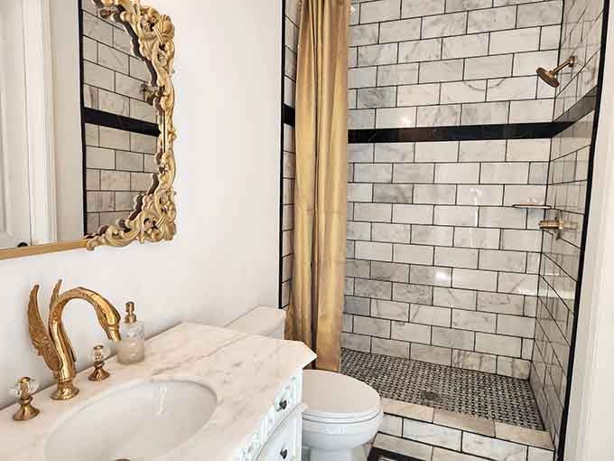 Even the bathroom maintains that elegant castle aesthetic, because why should modern plumbing compromise your medieval fantasy experience at all?