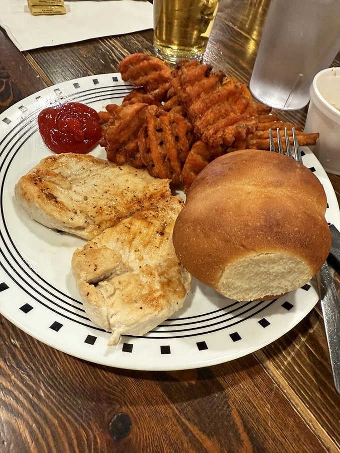 Grilled chicken breast with waffle fries shows they've mastered both the fryer and the grill with equal expertise.