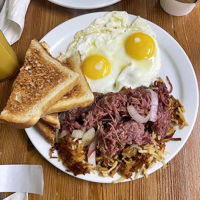 Corned beef hash with eggs that could make even the grumpiest morning person crack a smile over their coffee cup.