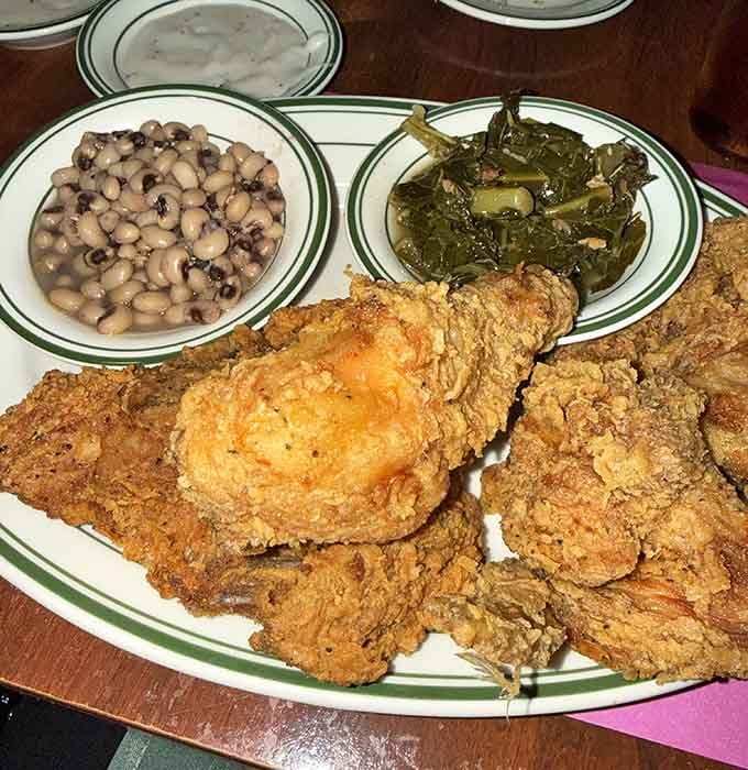 This plate of fried chicken, beans, and greens is basically a Southern family reunion on porcelain.