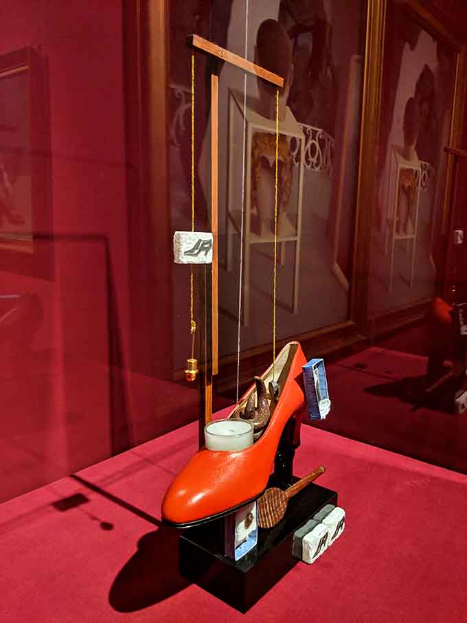 A high-heeled shoe suspended by strings&mdash;because normal footwear displays are for people without imagination.