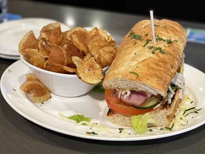 The Hippie Club sandwich arrives with house-made chips, proving peace and love taste pretty darn good together.