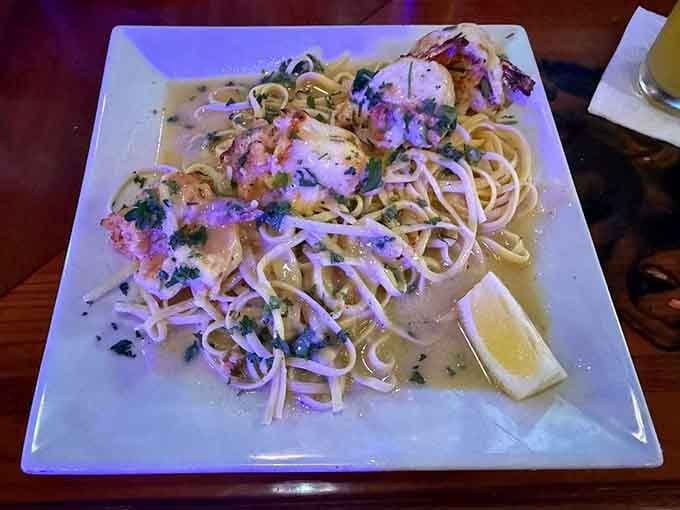 Plump shrimp stuffed with crab meat sit beside golden fries, creating a surf-and-turf moment worth celebrating properly.