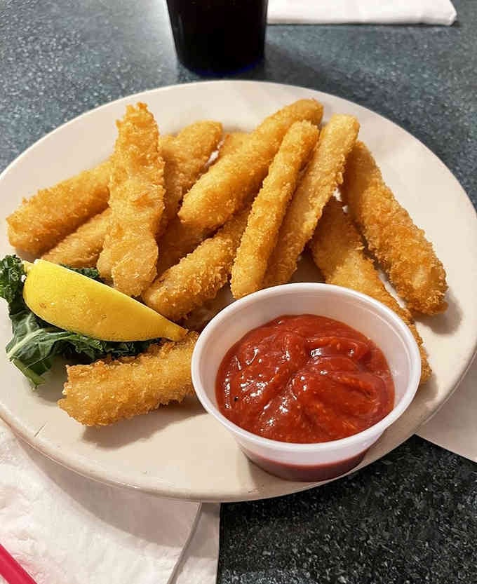 Golden fried calamari strips that prove the ocean's bounty tastes even better when it's been properly introduced to hot oil.