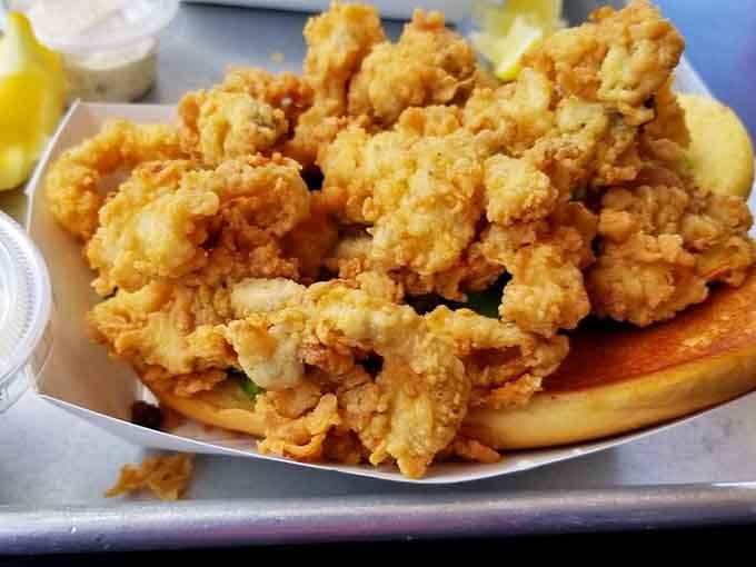 Fried clams piled high enough to require structural engineering and a side of pure happiness.