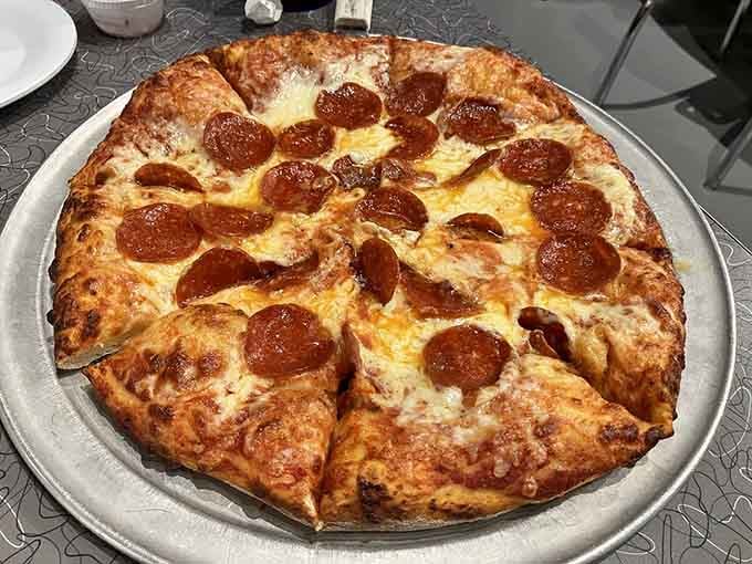 Pepperoni pizza with that golden, bubbly cheese crust shows this diner does more than just sandwiches.