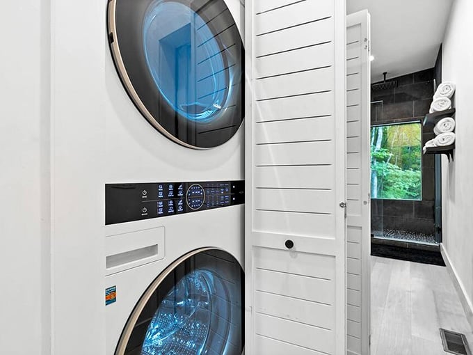 Even the laundry gets the modern treatment with stacked units tucked behind shiplap, because vacation doesn't mean wrinkled clothes.