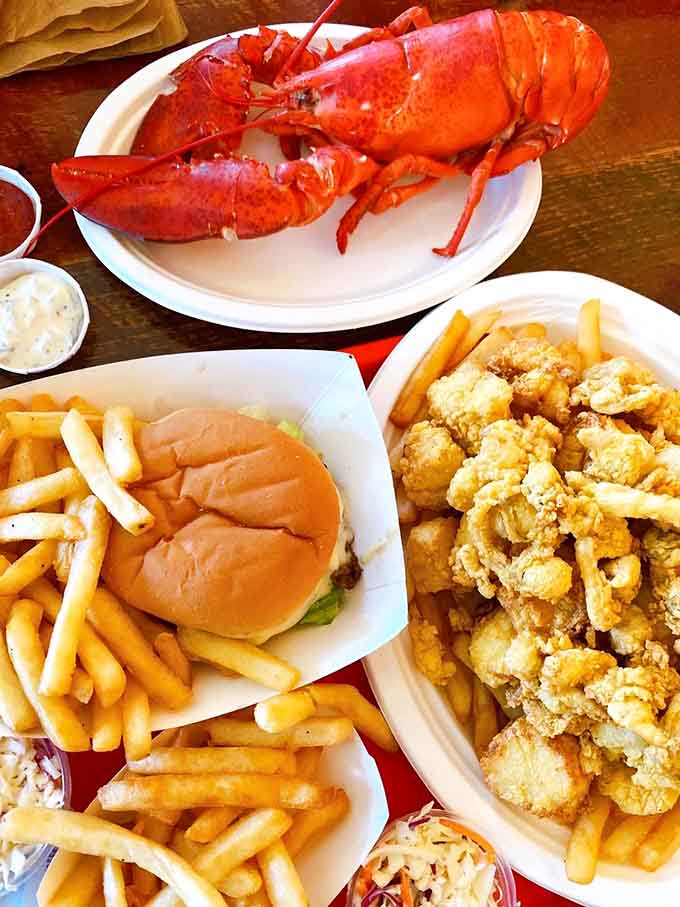 A whole steamed lobster surrounded by golden fried seafood is basically winning the lottery, except you actually get to enjoy it.