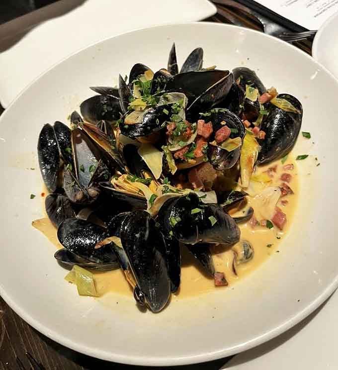 Fresh mussels swimming in a broth so good you'll want to drink it straight from the bowl.