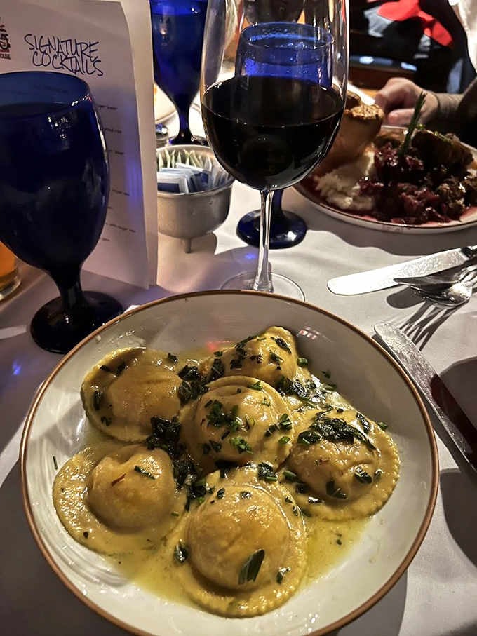 Pillowy ravioli swimming in sage butter sauce, comfort food elevated to something George Washington would definitely approve.
