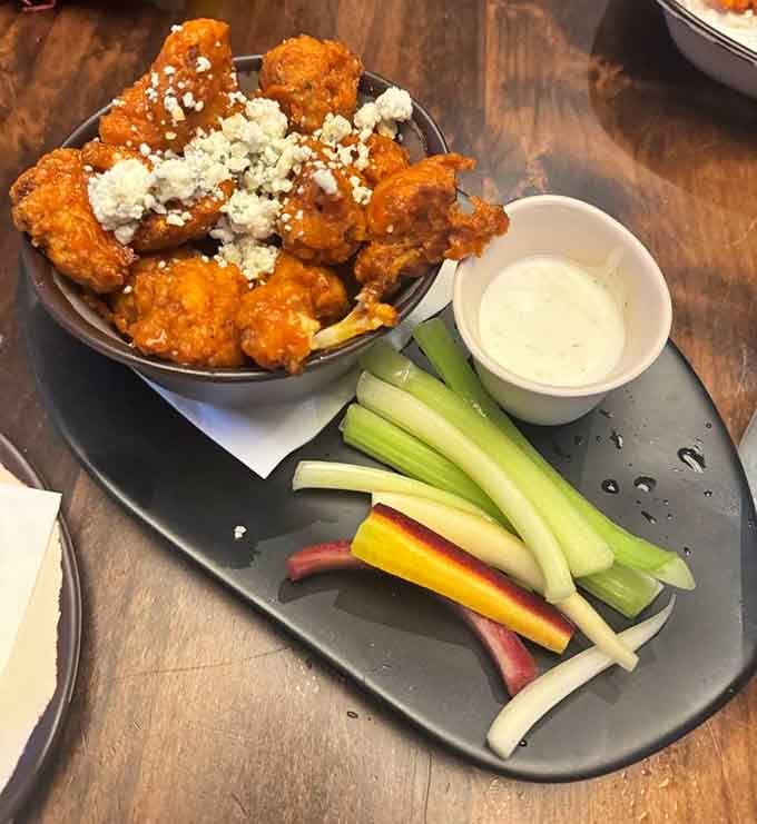 Buffalo cauliflower with blue cheese crumbles makes vegetables feel like a celebration, not a compromise.