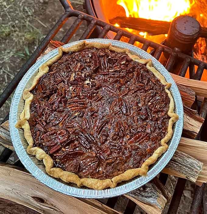 Bourbon pecan pie by a campfire, because some people understand how to live their best life.