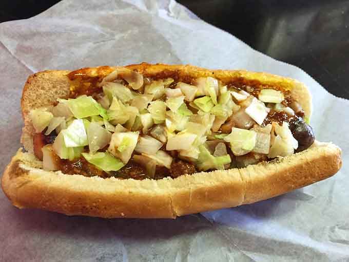 Fresh slaw piled high on a grilled hot dog, because sometimes vegetables make everything better, surprisingly enough.