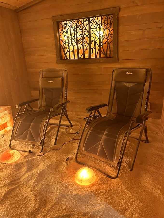 Two perfectly positioned chairs and that stunning backlit tree artwork prove that relaxation starts with beautiful, thoughtfully designed surroundings.