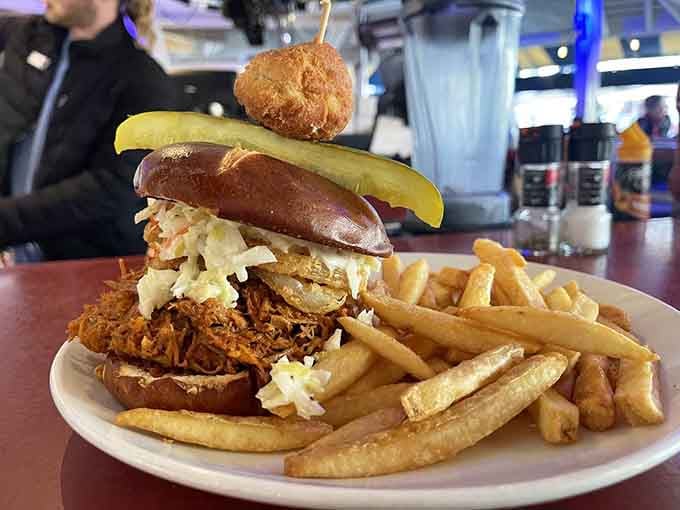 This towering sandwich situation requires an engineering degree and unhinging your jaw like a python to consume.
