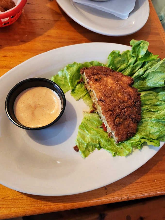 That perfectly crusted crab cake sitting on fresh lettuce is practically begging you to take a bite.