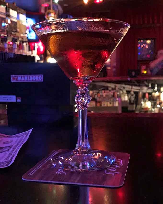 A classic Manhattan served in crystal-cut elegance, proving that bunker life doesn't mean sacrificing your refined taste for cocktails.