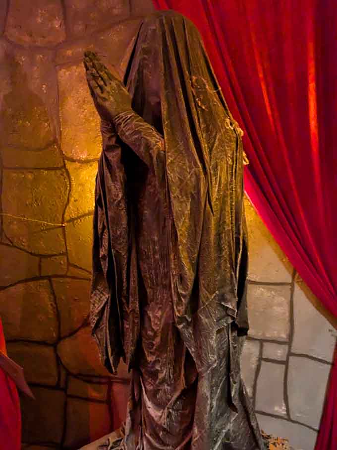 Draped figures and moody lighting create an atmosphere that's equal parts theatrical and genuinely spine-tingling.