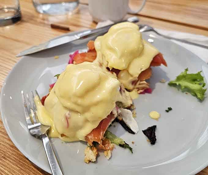 Poached eggs and hollandaise draped over salmon create a Benedict that's basically edible luxury on a plate.