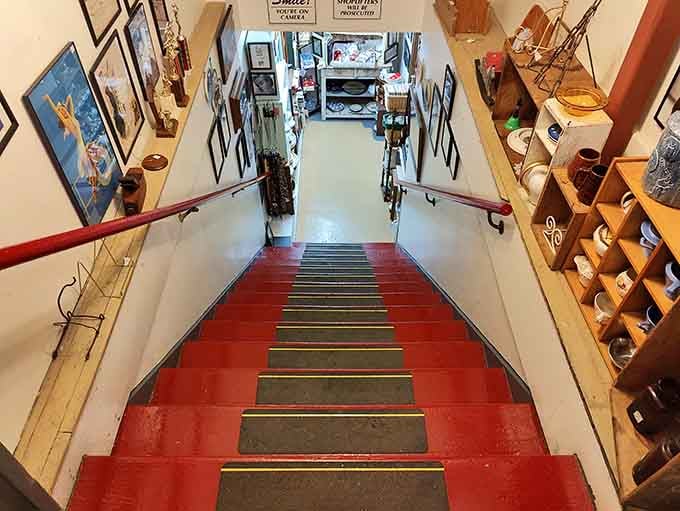 Those red-painted stairs lead to even more treasures upstairs – consider it your antique mall stairway to heaven.