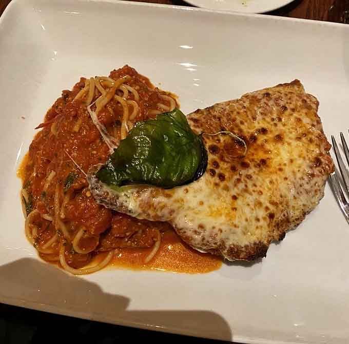 Veal parmesan proving that cheese-covered protein never goes out of style, no matter the decade.