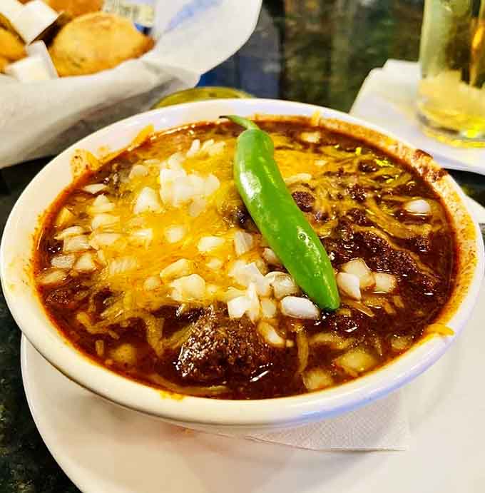 The Original Texas Red topped with cheese, onions, and a jalapeño – this is what chili dreams are made of.