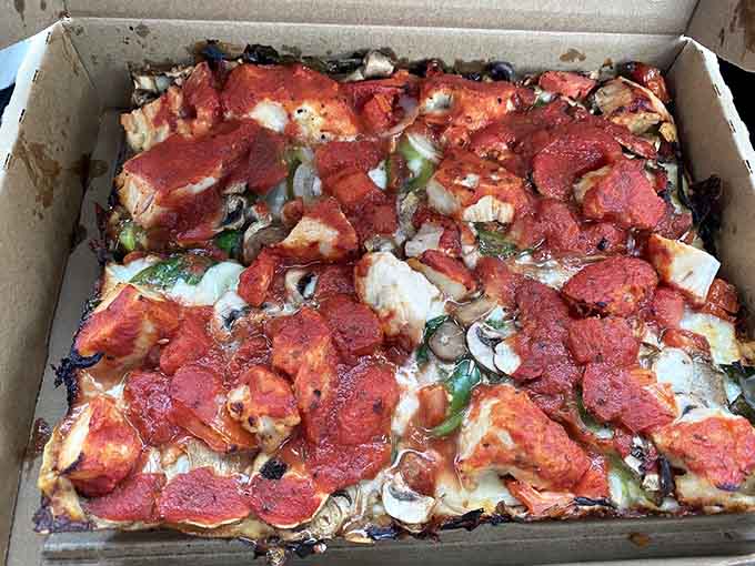 The veggie pizza is loaded with enough toppings to make even dedicated carnivores reconsider their life choices temporarily.