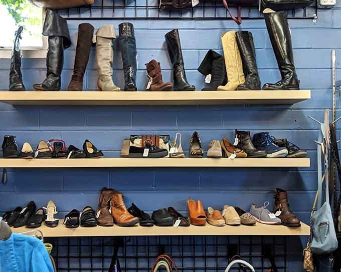 Boots and shoes displayed on blue walls like footwear art that won't break your budget.