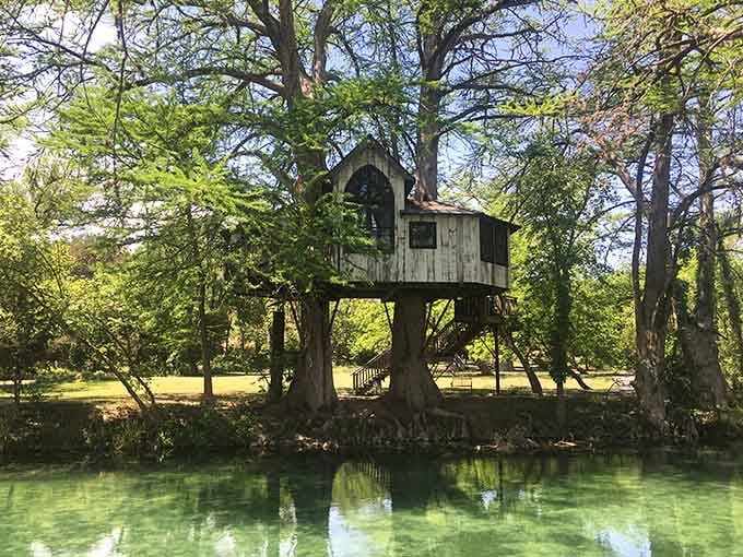 The Chapelle treehouse perched above crystal-clear water looks like something from a particularly enchanting fever dream.