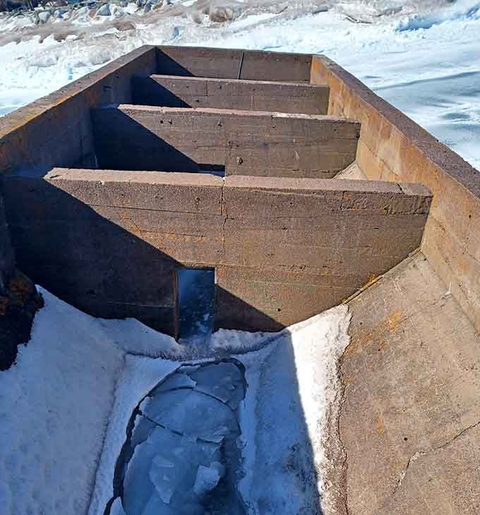 Inside reveals the structure's bones, concrete partitions that once had a purpose beyond becoming Instagram-worthy ruins.