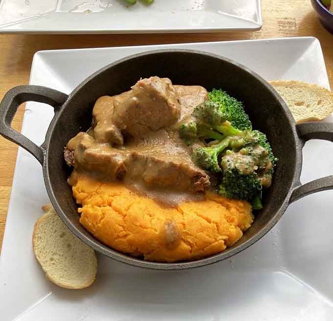 Braised beef with mashed sweet potato in a cast iron skillet, served like your Dutch grandmother would if she were incredibly cool.