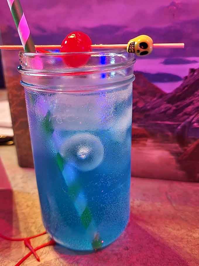 Skull garnishes and blue liquid make this cocktail look dangerously fun, emphasis on both words equally.