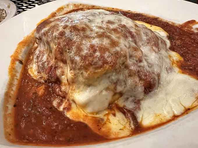 Lasagna so generously cheesed it practically requires architectural support and extra napkins for everyone.