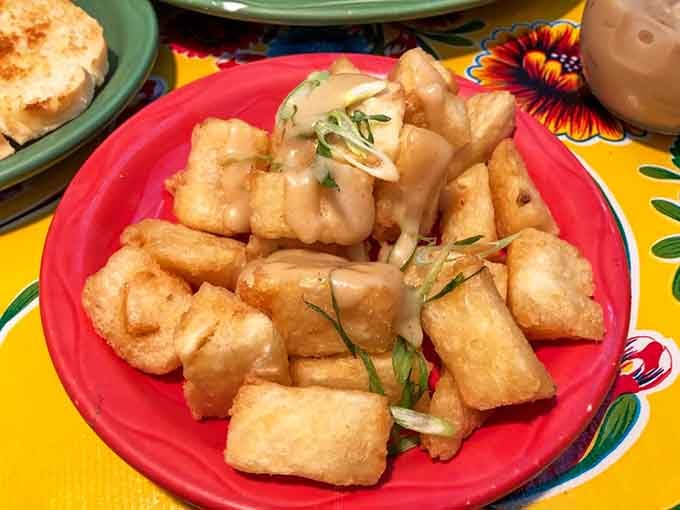 Crispy yuca fries with that perfect golden exterior are basically the tropical cousin your regular fries wish they were.