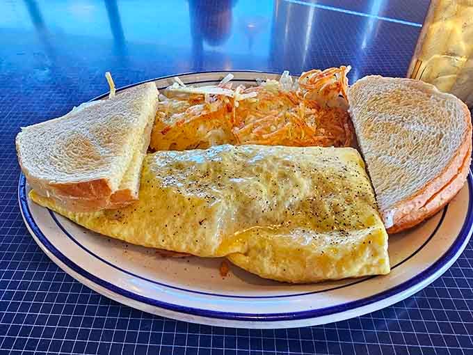 A fluffy omelet that demonstrates the beautiful difference fresh shelled eggs make, paired with perfectly golden hashbrowns and toast.