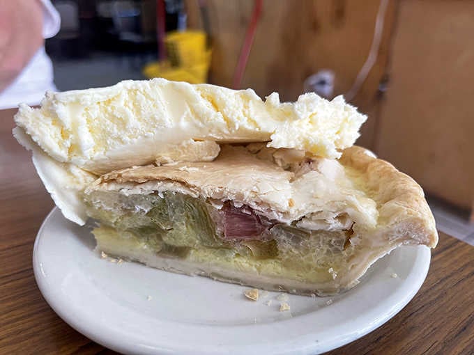 Rhubarb custard pie topped with clouds of meringue, because some traditions deserve to live forever.