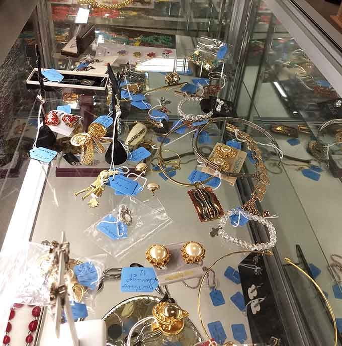 The jewelry case sparkles with possibilities, from costume pieces to potential hidden gems waiting for sharp-eyed discoverers.