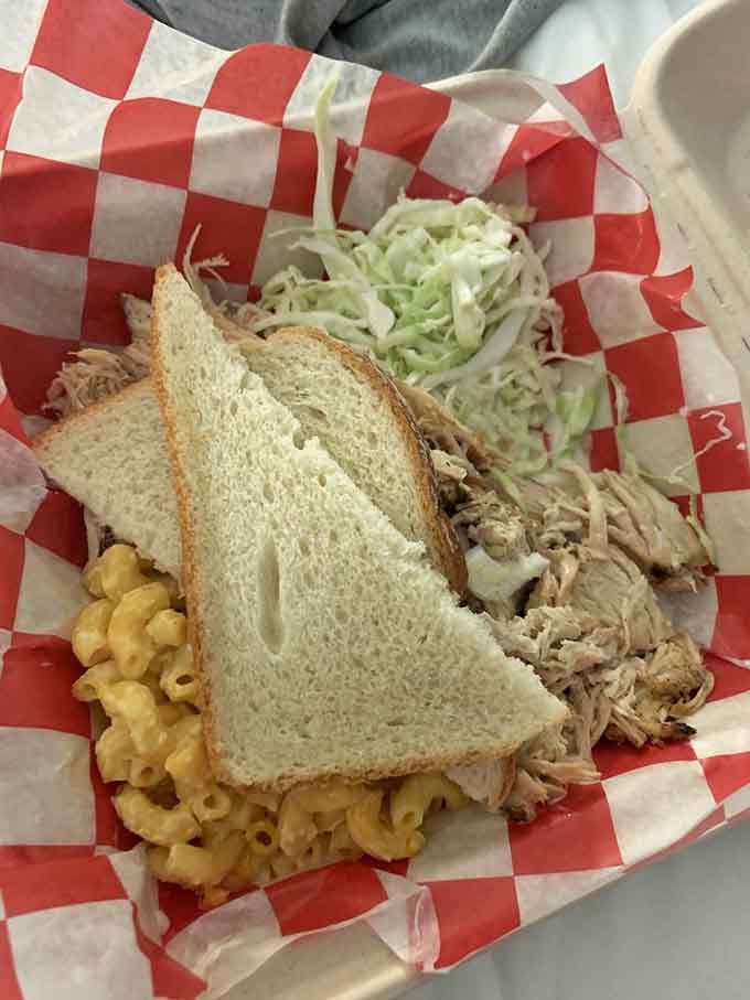 Smoked chicken, sides, and bread come together in a plate that understands what comfort food really means.