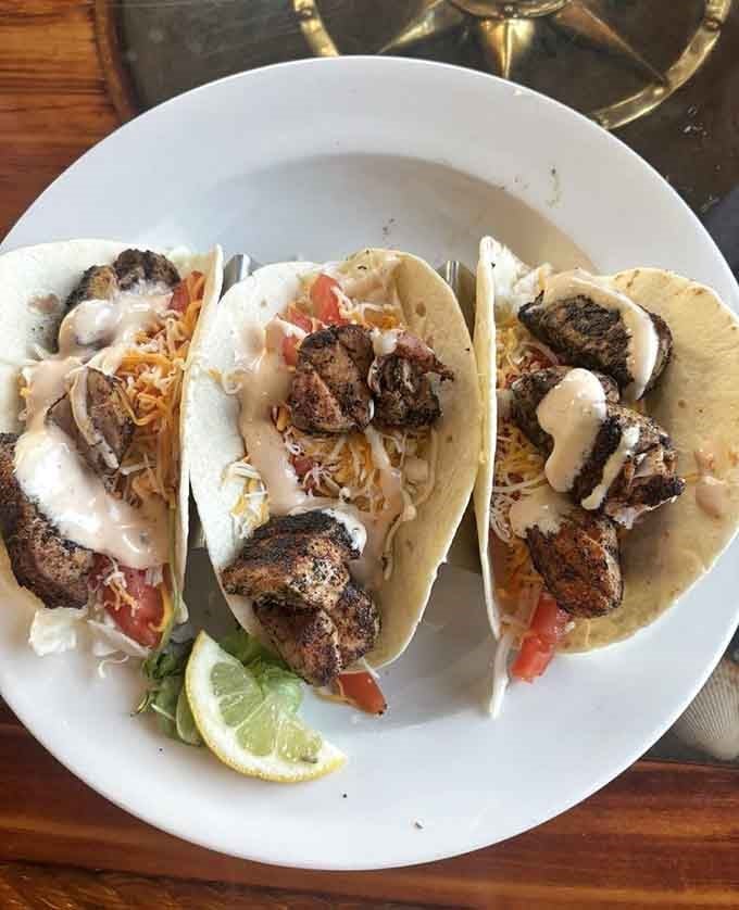 Blackened tuna tacos bringing a little spice and a lot of flavor to your table, beach vibes included.
