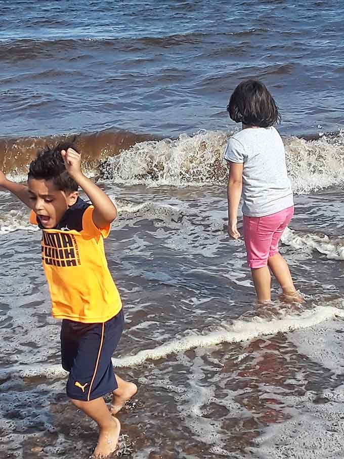 Pure joy looks like kids discovering waves for possibly the thousandth time but acting like it's brand new.