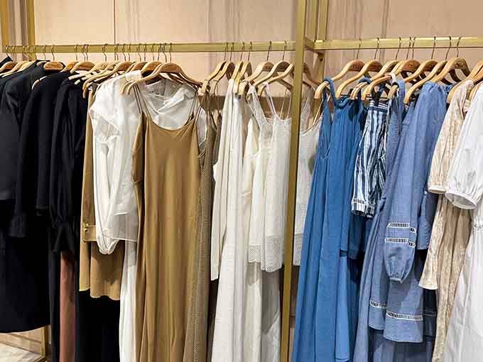 Flowing dresses and crisp blouses hang like possibilities, waiting to transform your closet from "meh" to magnificent without breaking the bank.
