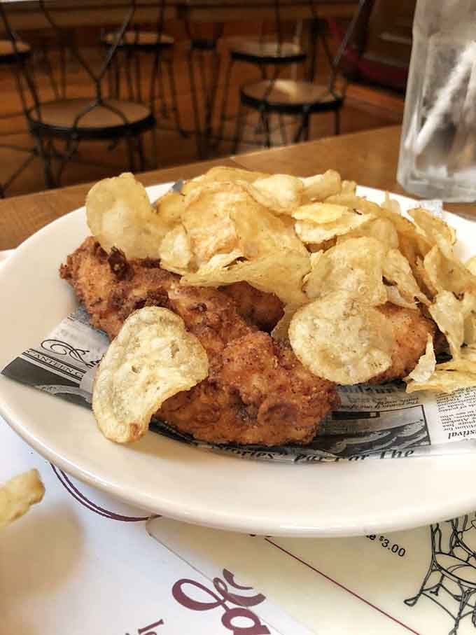 Breaded chicken tenders piled high with chips &ndash; because sometimes you need protein before tackling a banana split properly.