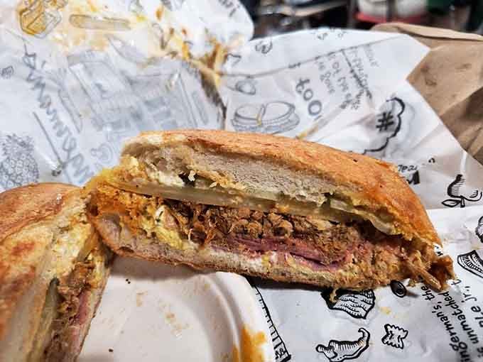 The Cuban sandwich arrives pressed to perfection, with melted cheese oozing out like edible lava flows everywhere.