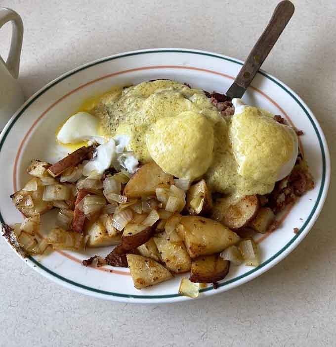 Eggs Benedict meets corned beef hash in this beautiful marriage of breakfast traditions and generous portions.