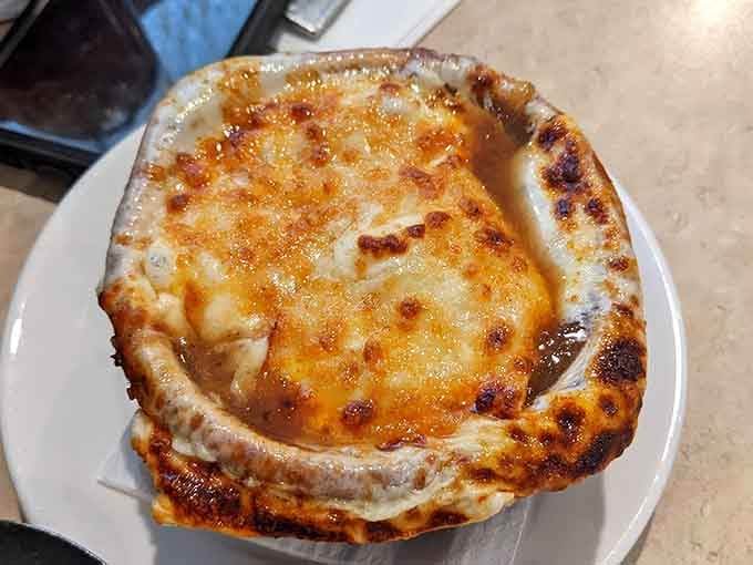 French onion soup with a cheese blanket so thick it could survive a Pennsylvania winter.