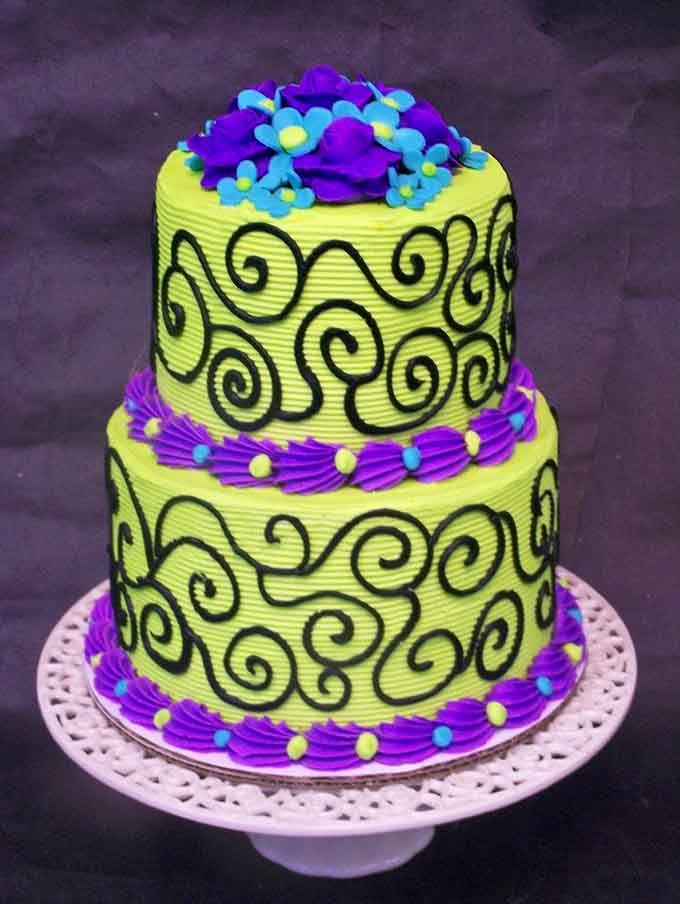 This vibrant two-tier masterpiece features bold swirls and colors that would make even the most reserved party absolutely unforgettable.