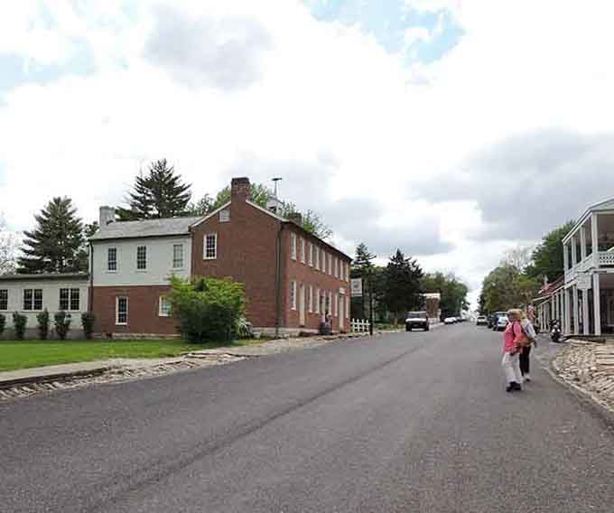 Brick buildings with white-trimmed windows stand quiet and dignified, like they've seen everything and aren't easily impressed by modern nonsense.
